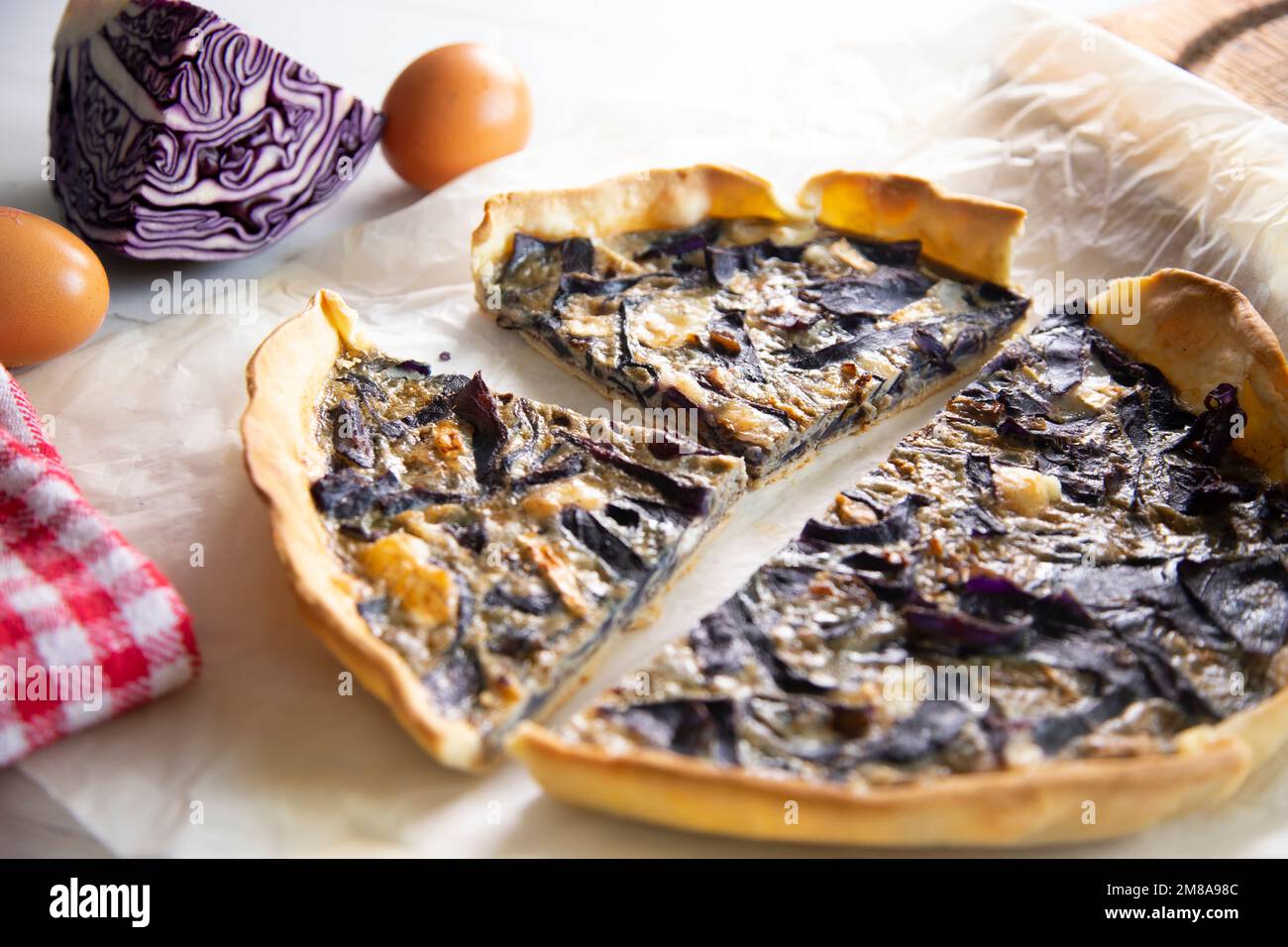 Red cabbage French quiche. In gastronomy, a quiche is a type of savory ...