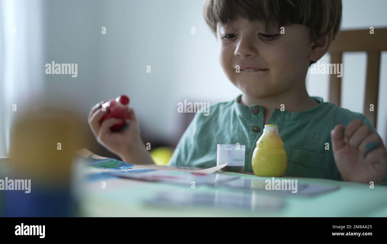 Child paint creativity activity at home. Artistic little boy painting ...