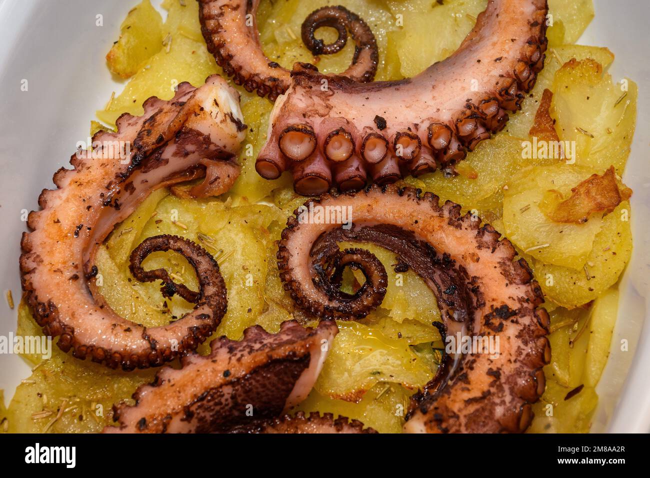 Grilled Octopus With Potatoes Appetizer Stock Photo - Alamy