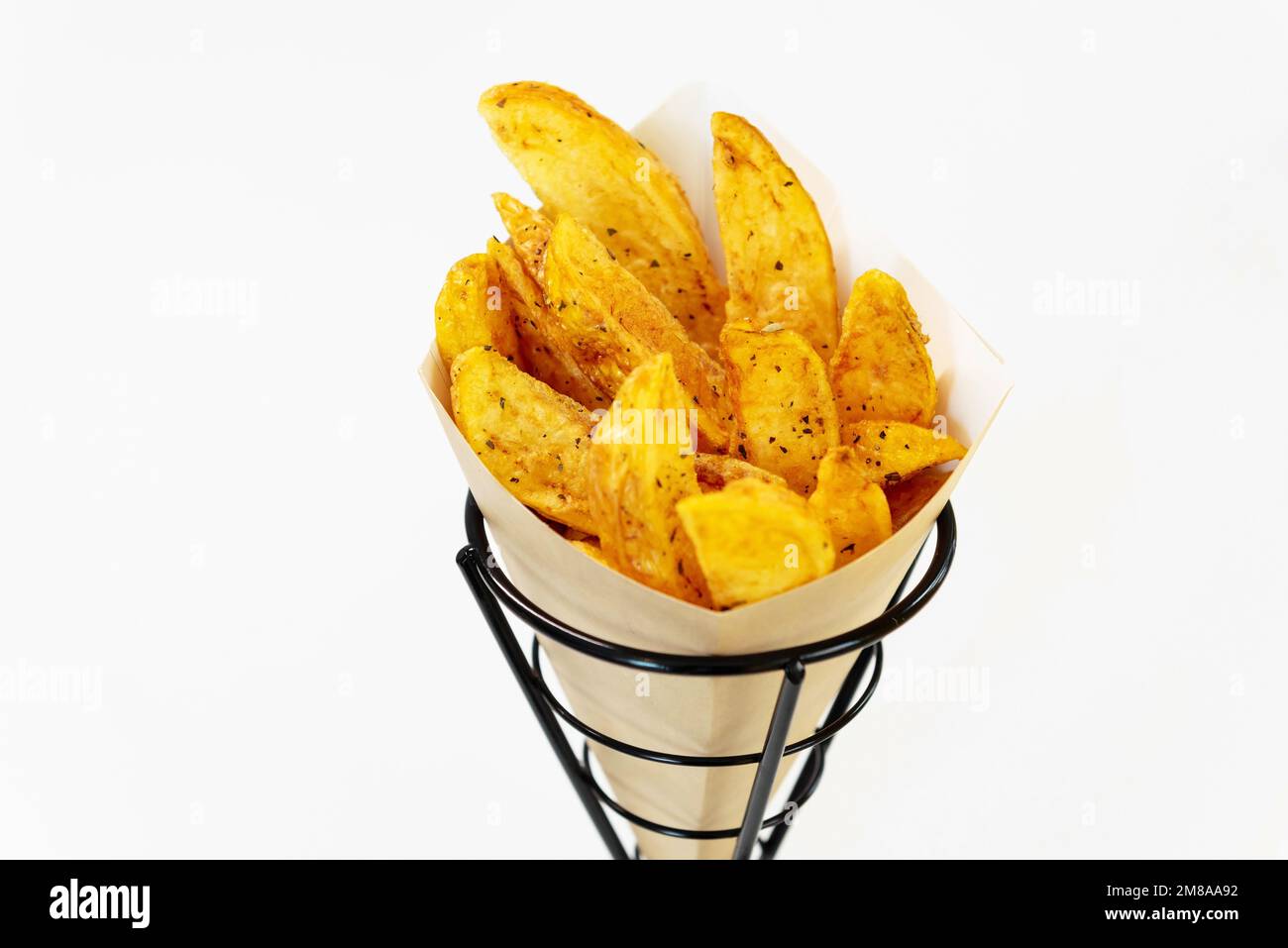 Oven baked potato wedges with sea salt and herbs. fries in a recyclable ...