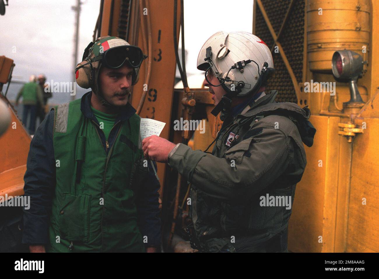 An Airborne Early Warning Squadron 122 (VAW-122) air crewman has a ...