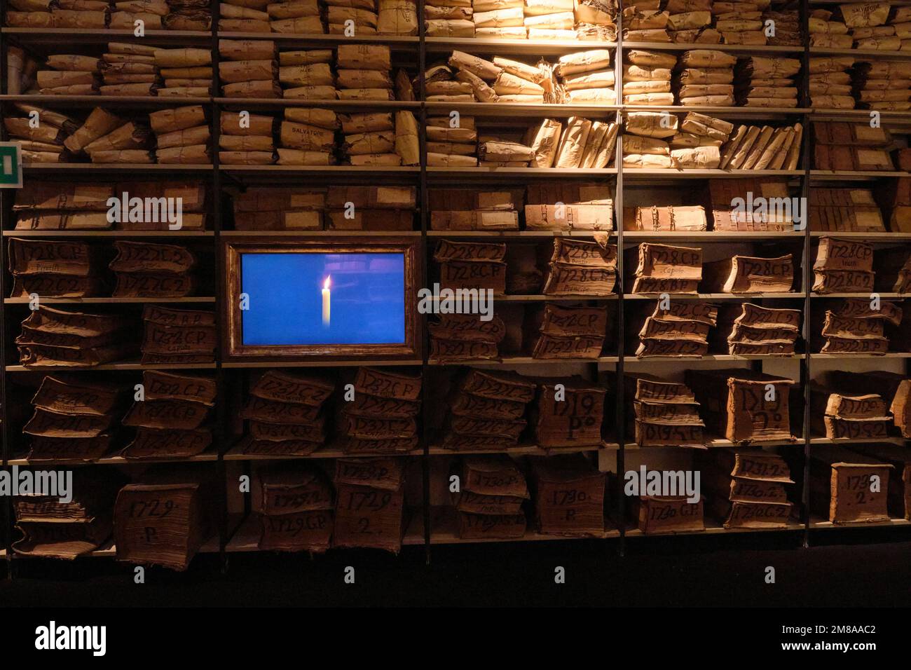Interior gallery, displaying stacks of old bank ledger, yellowed, sepia ...