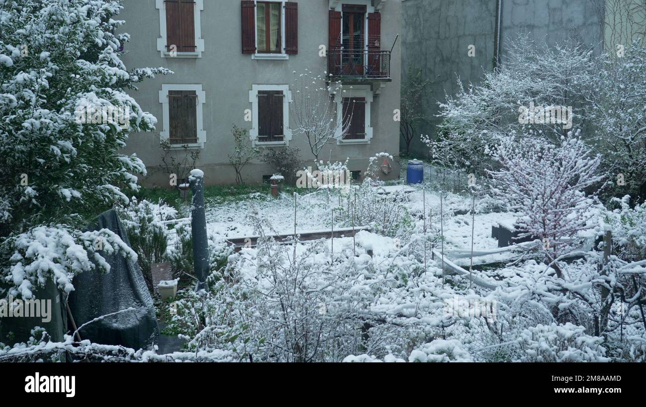 Home backyard covered in snow during winter season. House residence ...