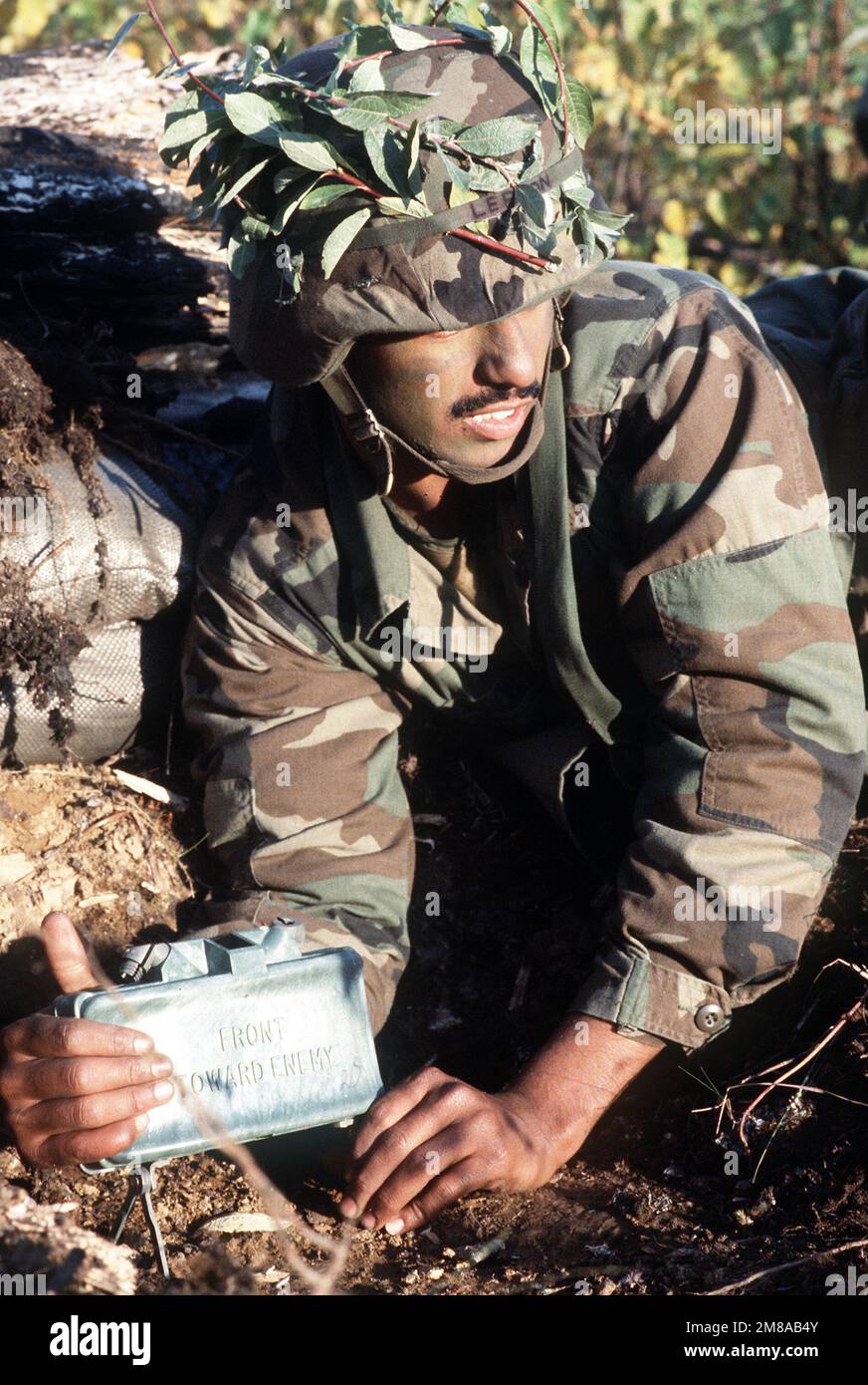 SGT. Pedro Lebron, Co. A, 1ST Bn., 17th Inf., sets a Claymore mine for ...