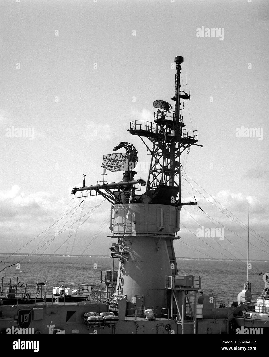 A close-up view of the SPS-40 air search radar, center, and the smaller ...