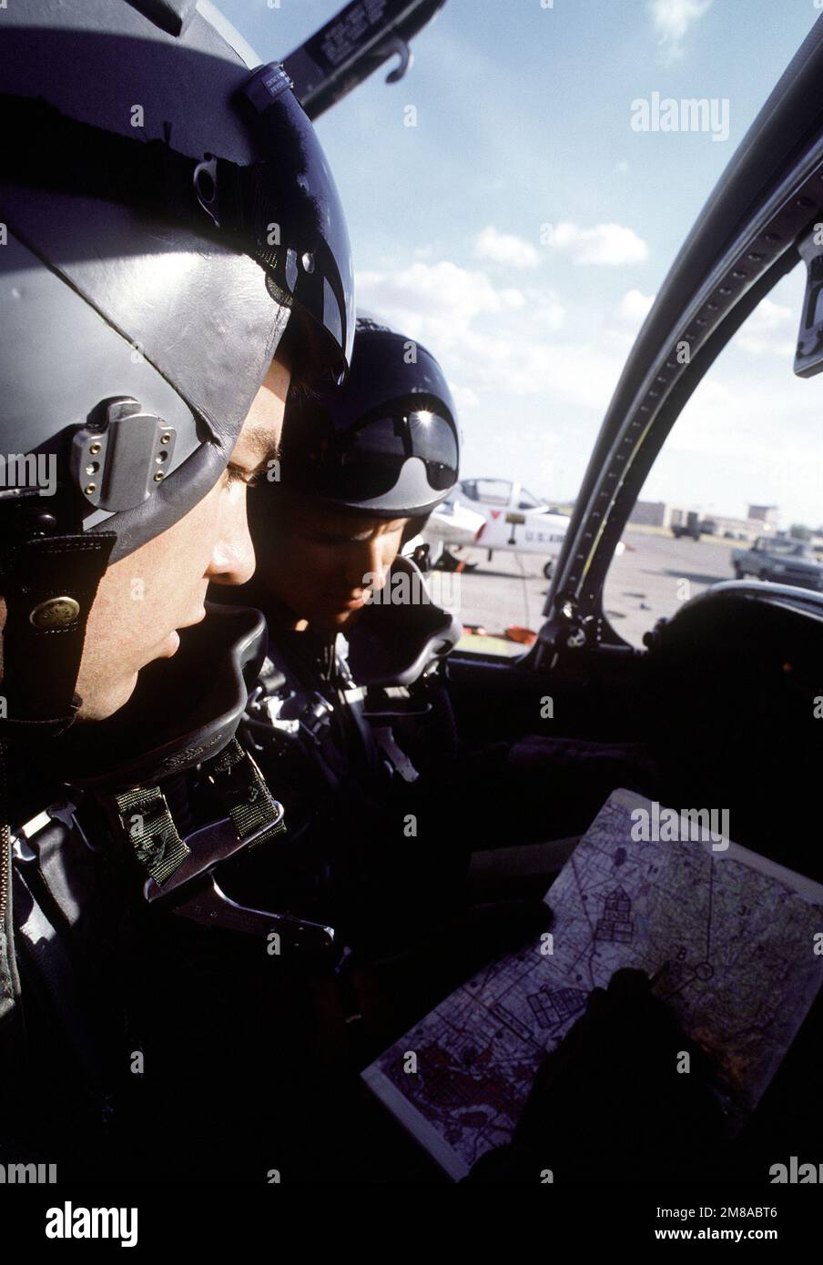 Undergraduate navigator training students plot their course before a ...