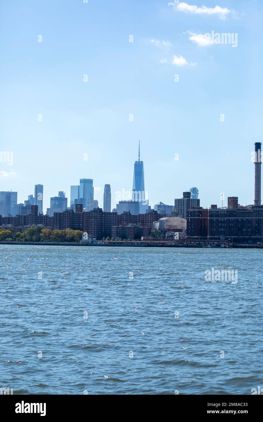 A vertical shot of a view of Manhattan from the water in New York City ...