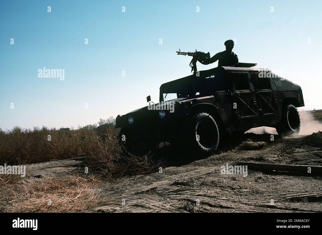 During a training operation a security policeman mans a M60 machine gun ...