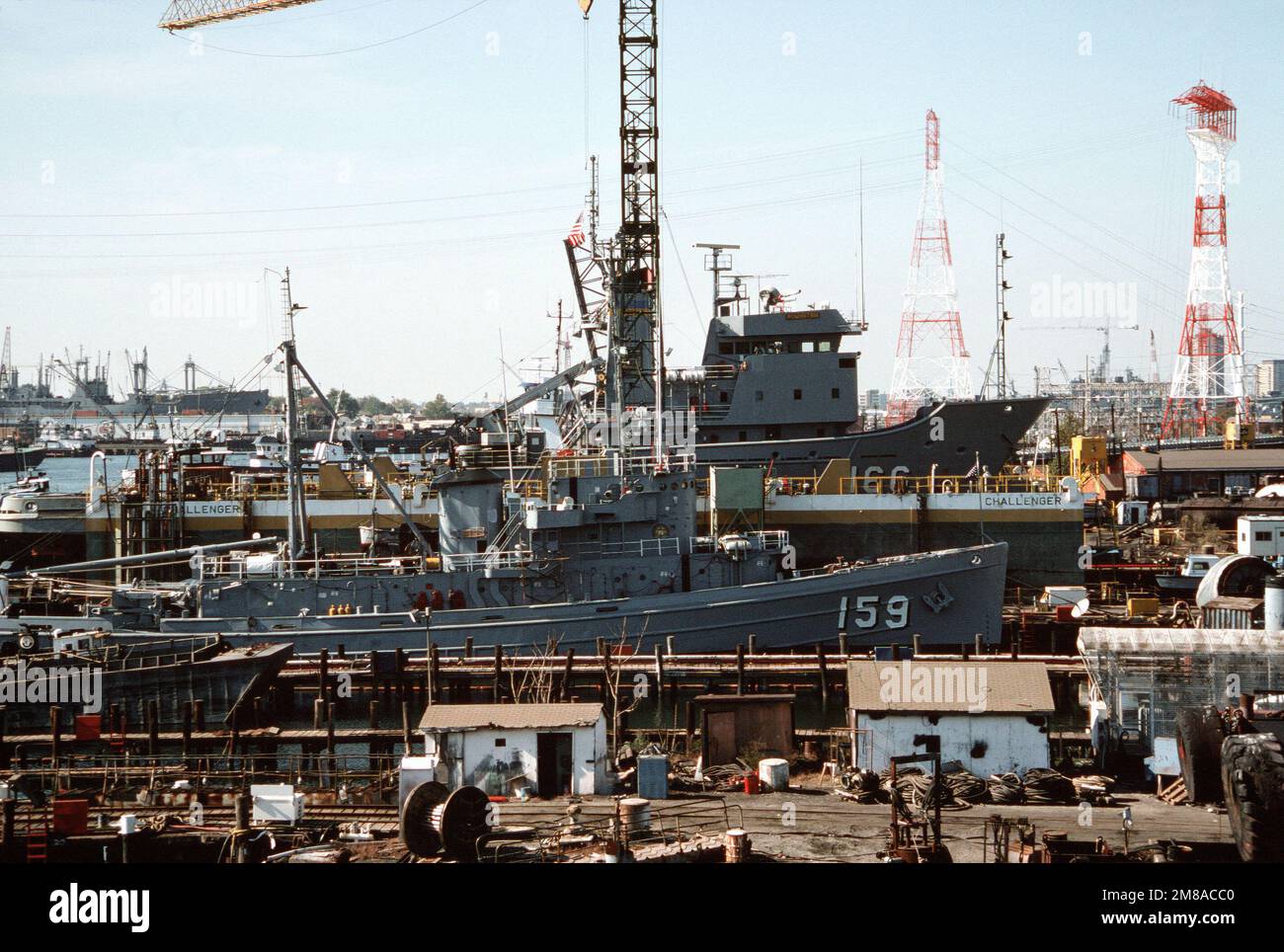 A starboard view of the fleet tug USS PAIUTE (ATF 159), foreground, and ...