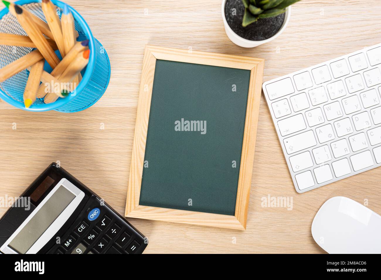 School chalkboard mockup on work desk. Composition of a student's desk ...