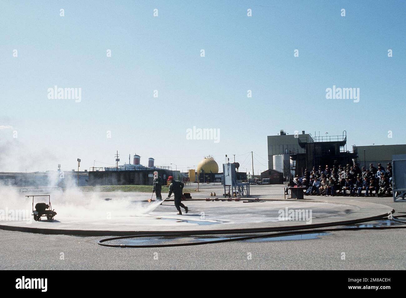 Instructors demonstrate the use of the firefighting agent Purple-K ...