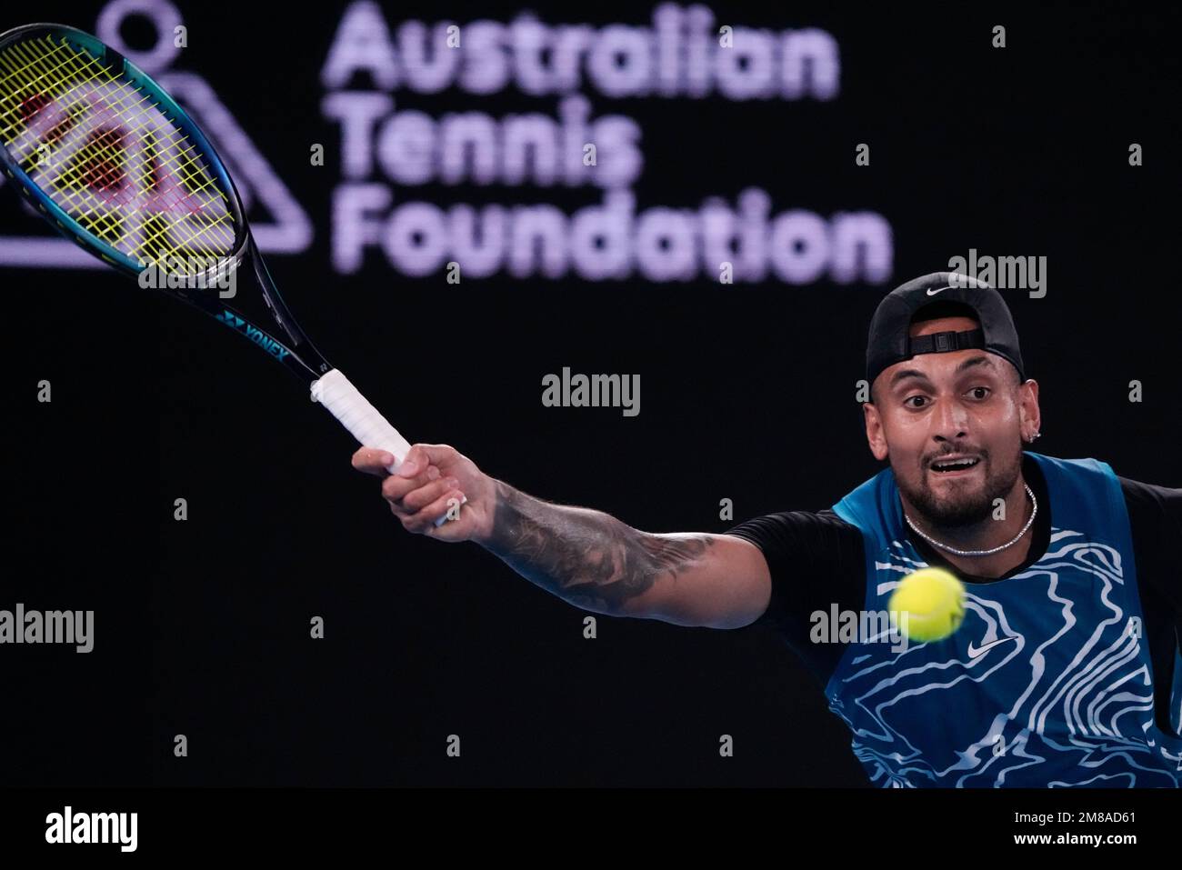 Australia's Nick Kyrgios plays a forehand return to Serbia's Novak ...