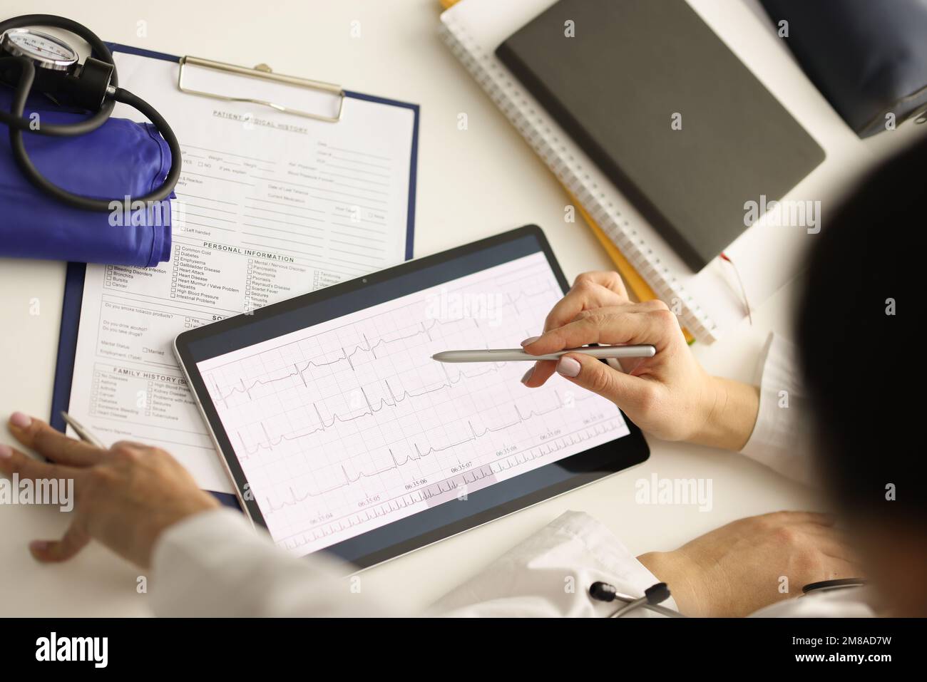 Doctor looks ecg on hi-res stock photography and images - Alamy