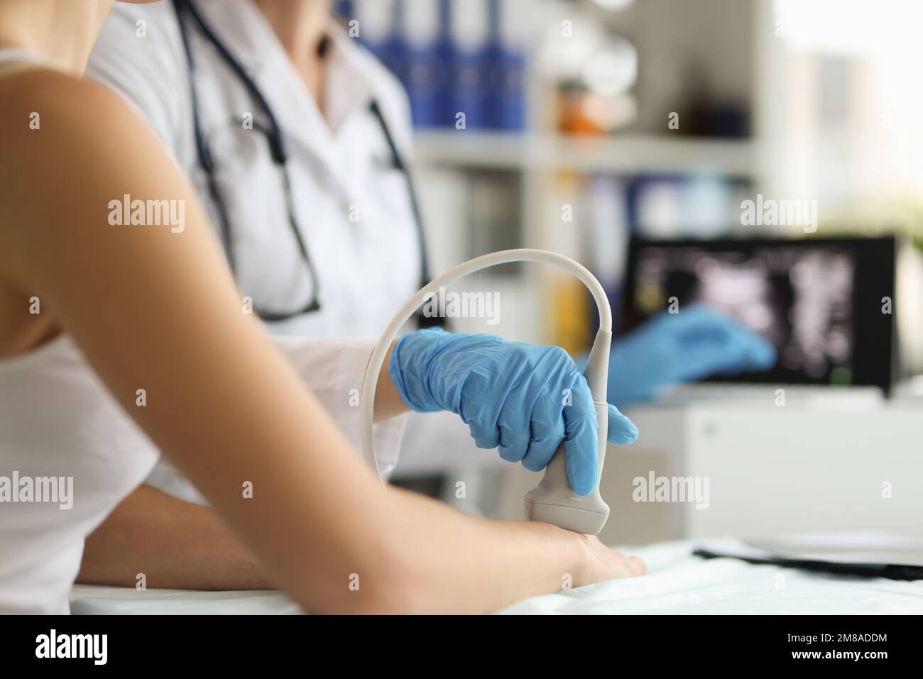 Doctor makes ultrasound of hand wrist in clinic Stock Photo - Alamy