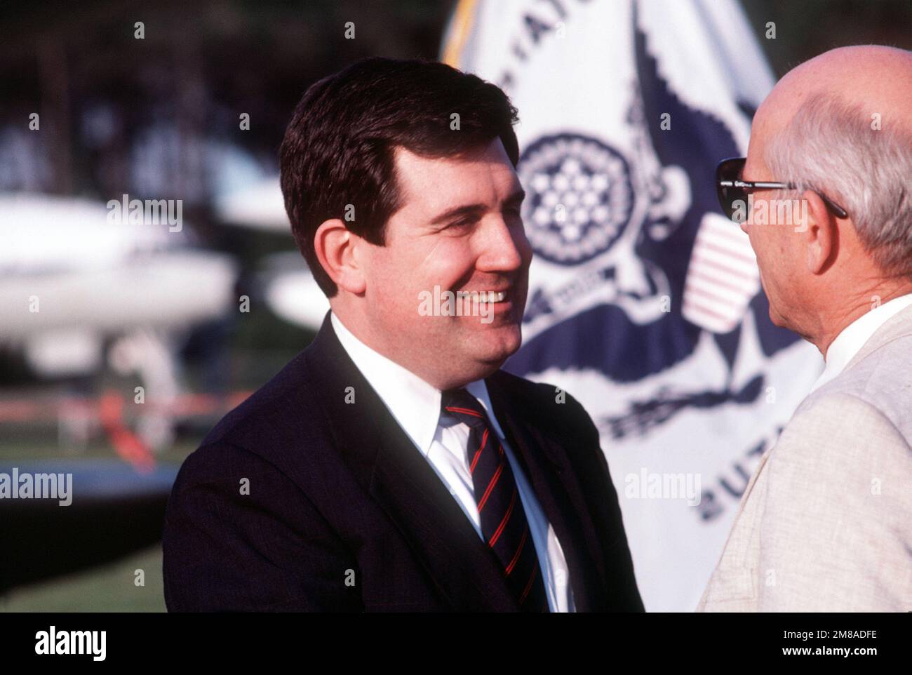 Secretary of the Navy William L. Ball III converses with dignitaries at the groundbreaking ...