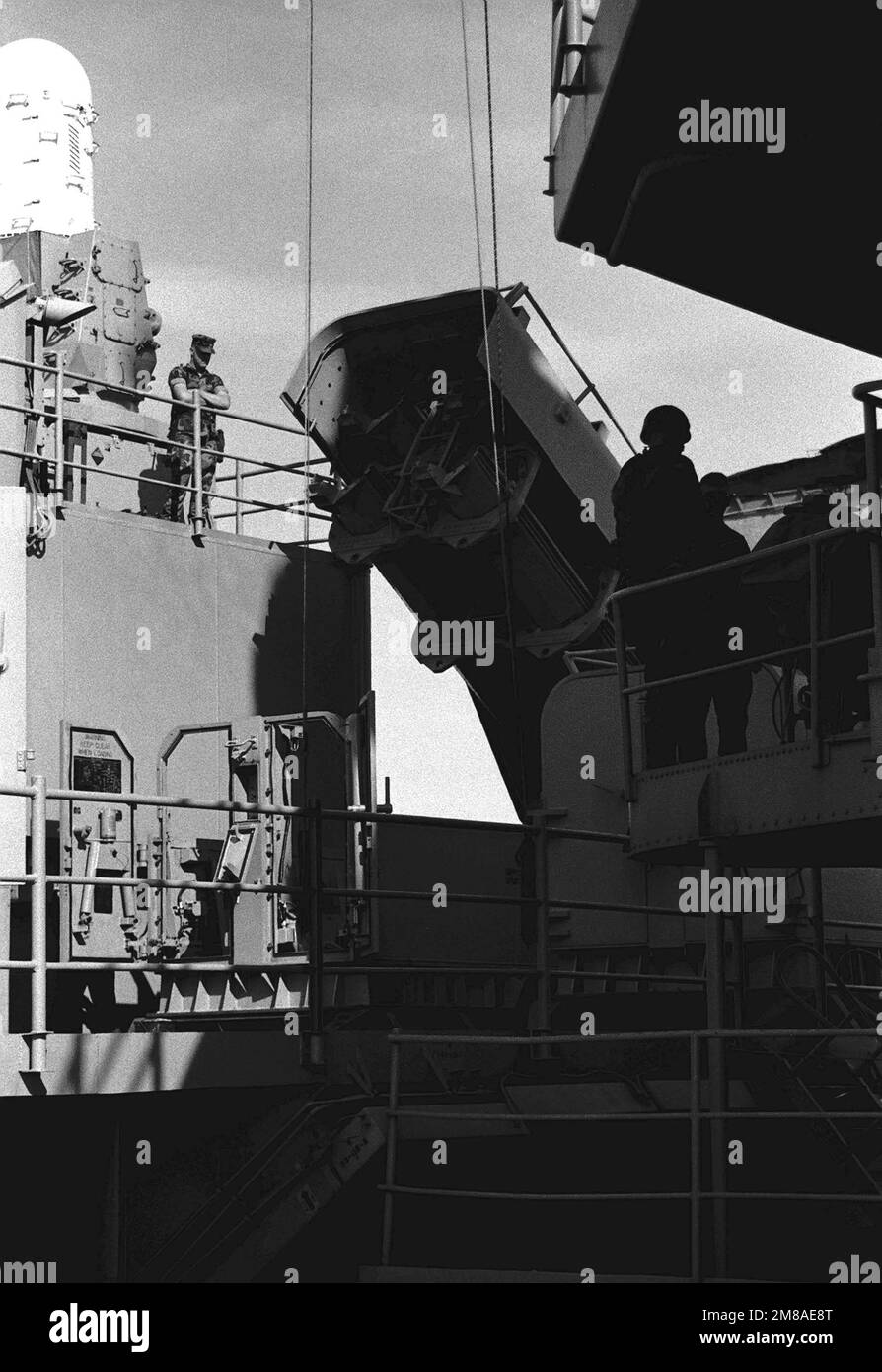 A Mk. 143 armoured missile box is open in preparation for loading of a ...
