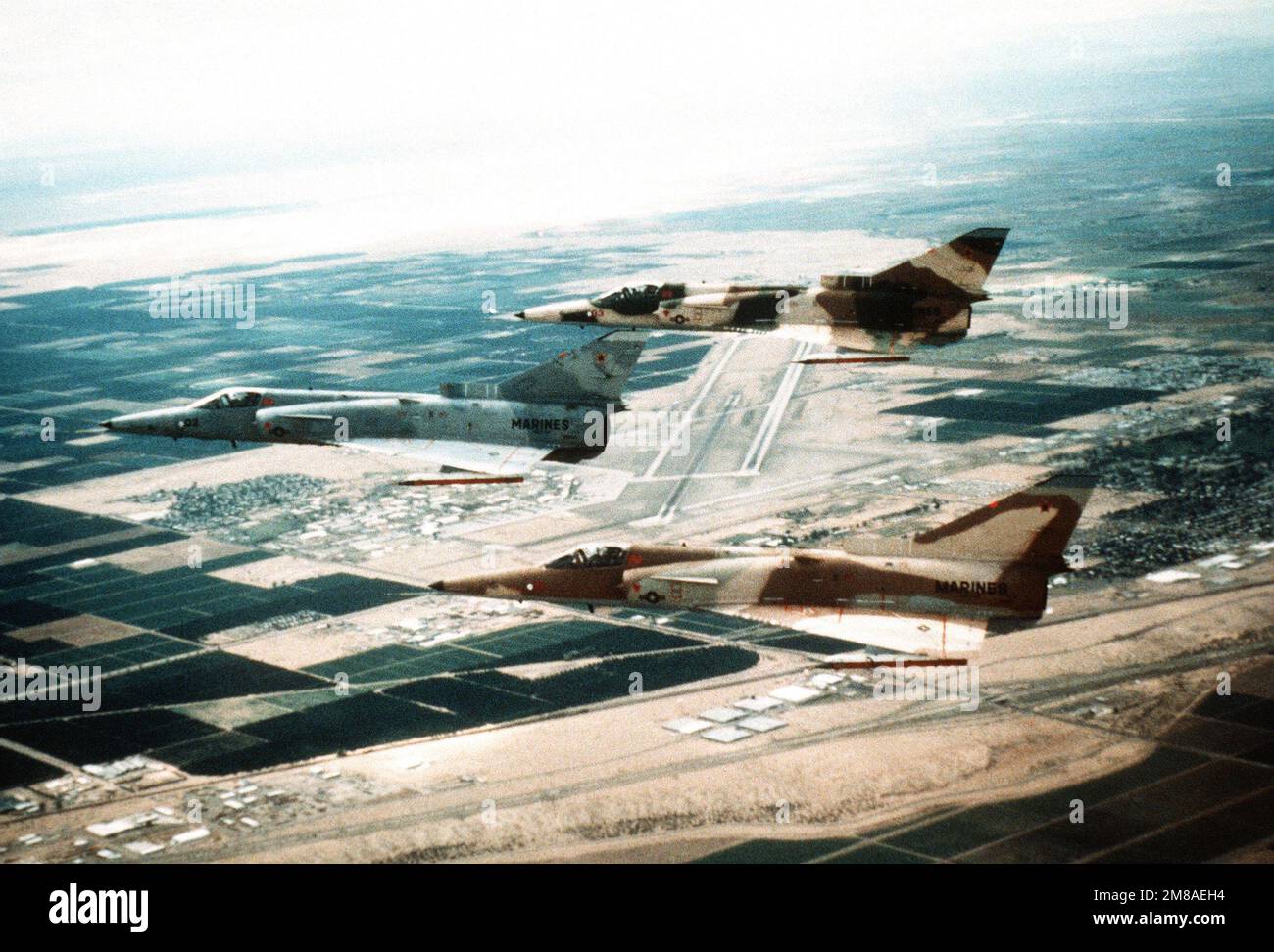 An air-to-air left side view of three Israeli-built F-21A Kfir aircraft ...