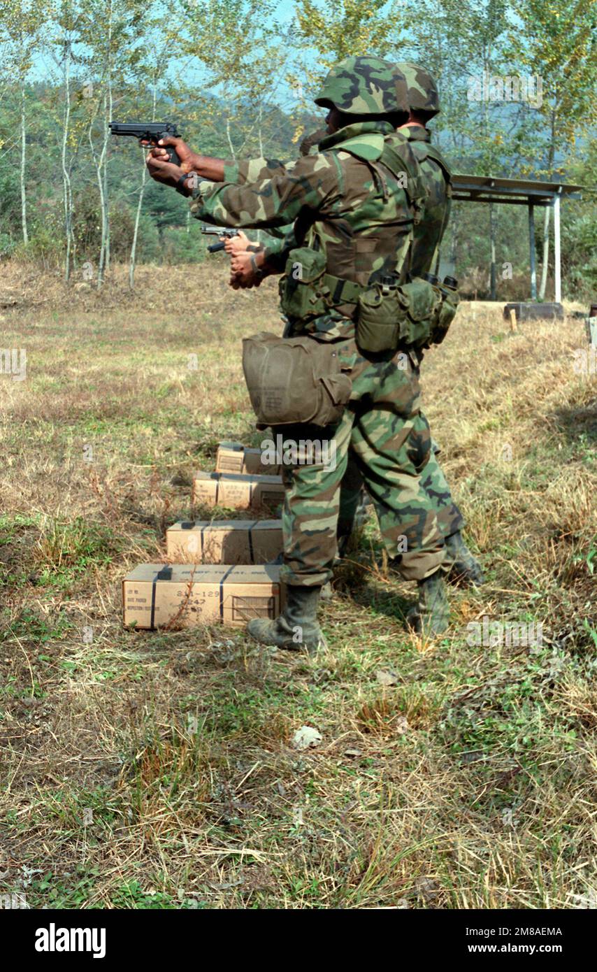 Members of Headquarters Battery, 12th Marines, fire 9mm M-9 Beretta ...