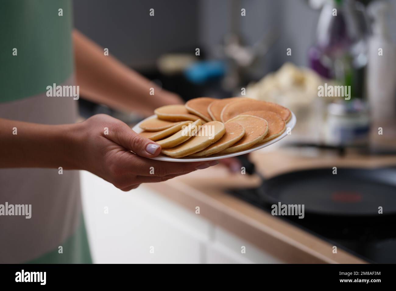 Woman holds plate cake hi-res stock photography and images - Alamy