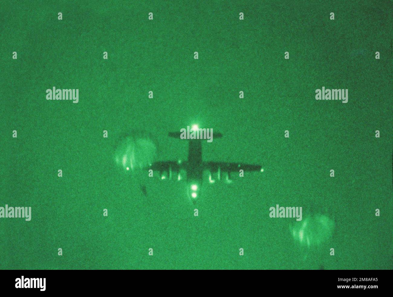 As seen through a night observation device, members of Detachment 3 ...