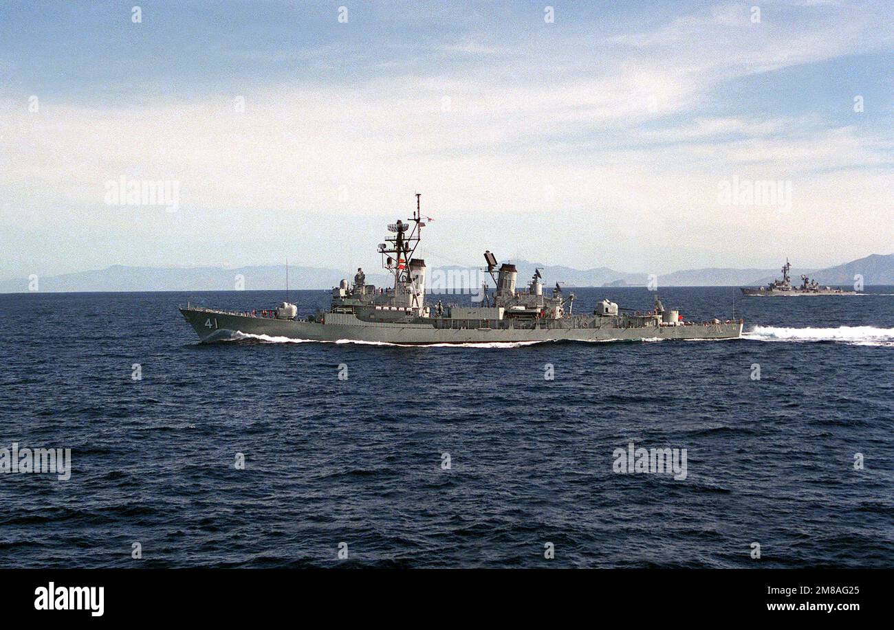 A port beam view of the Australian destroyer HMAS BRISBANE (D-41) and ...