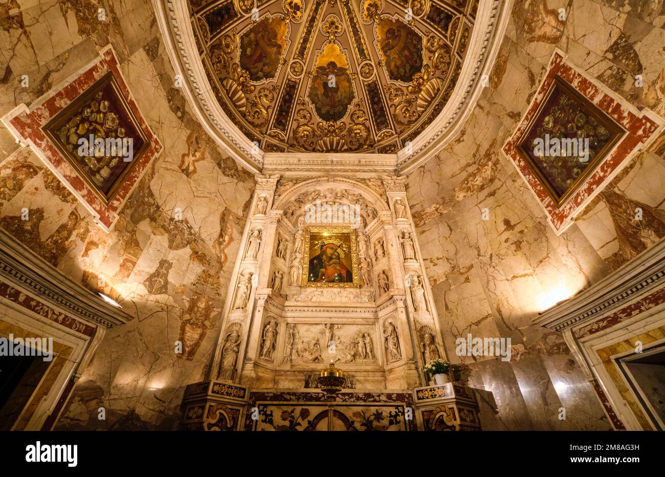 Looking up at a painting of the Virgin Mary with the baby Jesus in a ...