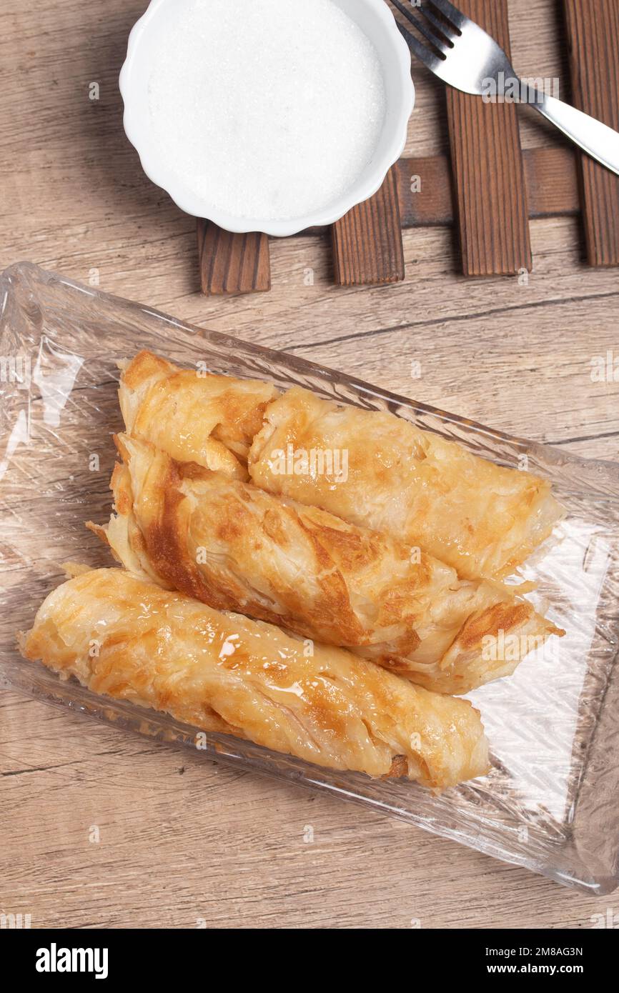 Fried Roti with Sweetened Condensed Milk Thai Dessert Stock Photo - Alamy