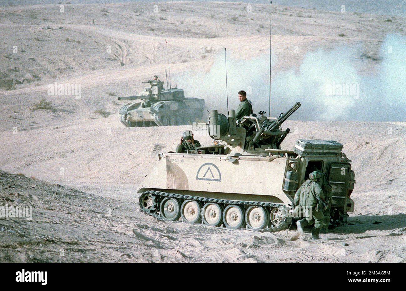 A soldier of the 24th Infantry Division (mechanized) moves toward the ...