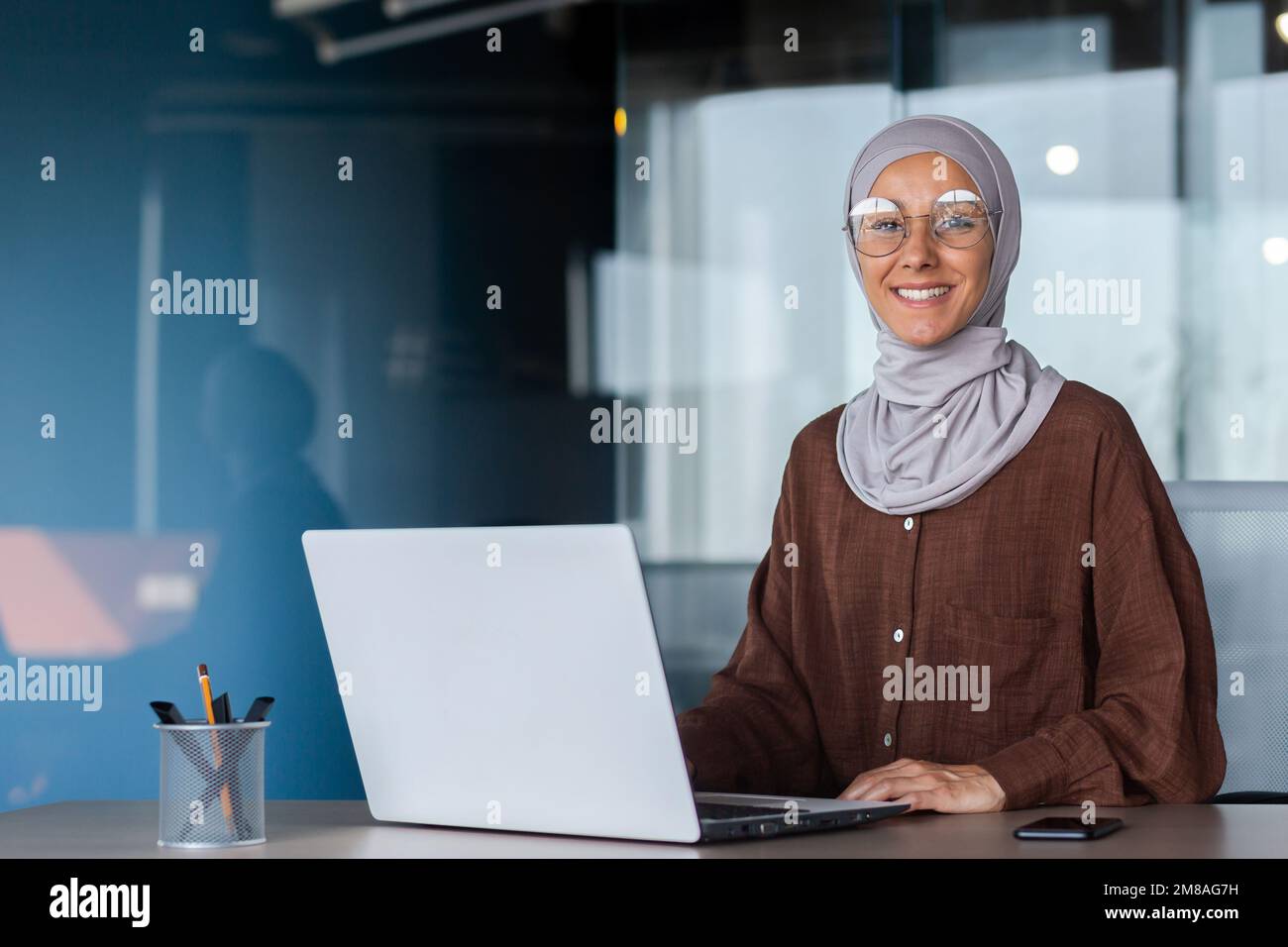 Portrait of successful businesswoman inside office with laptop, woman ...