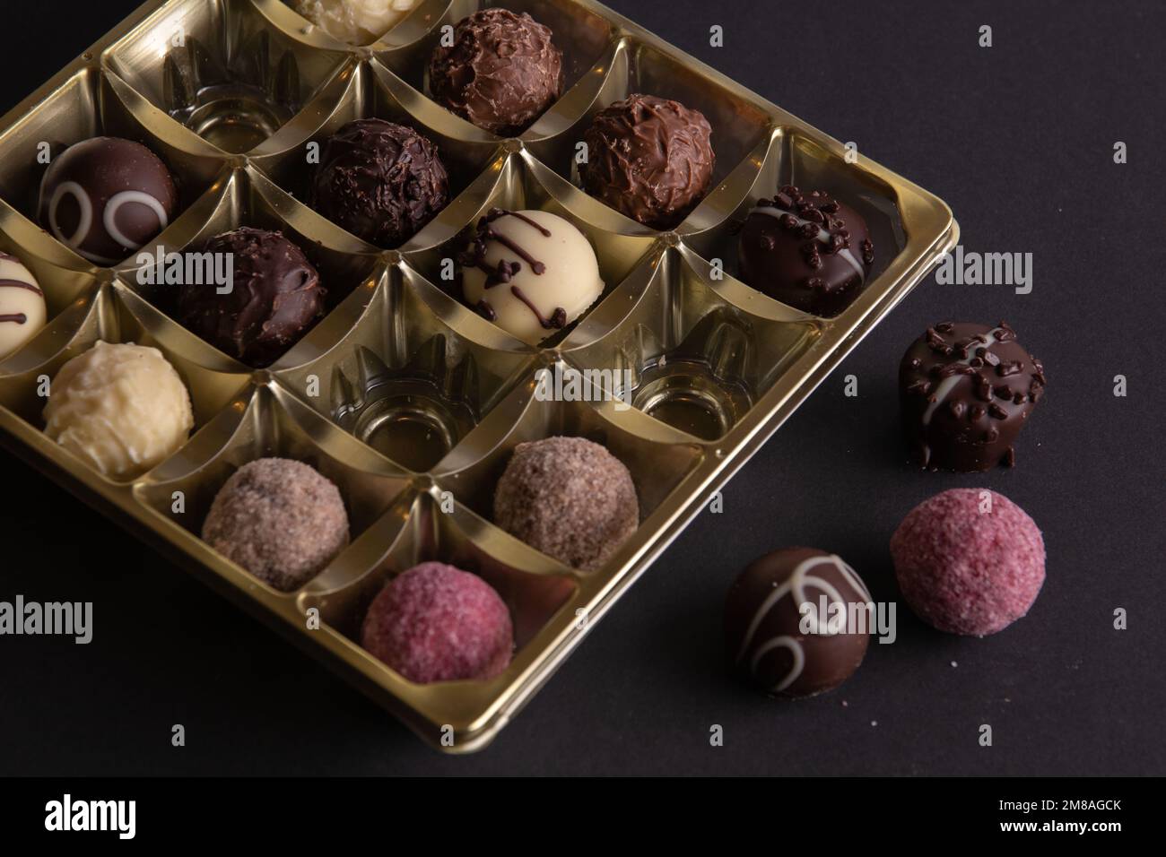 photo of many different chocolates lying in a box several different ...