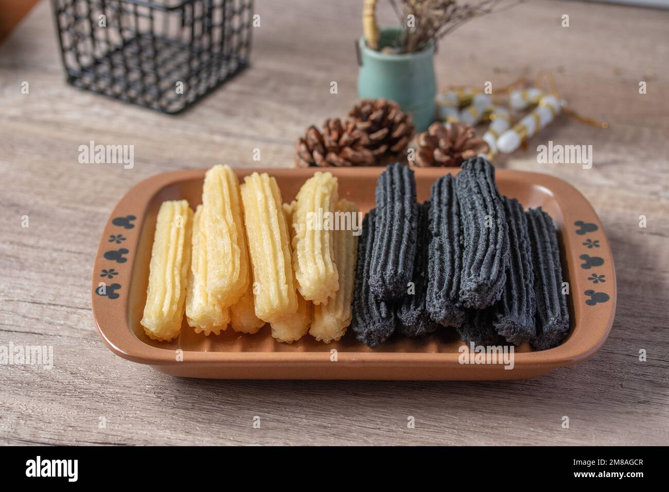 churros sticks typical of Spain with charcoal and vanilla Stock Photo ...