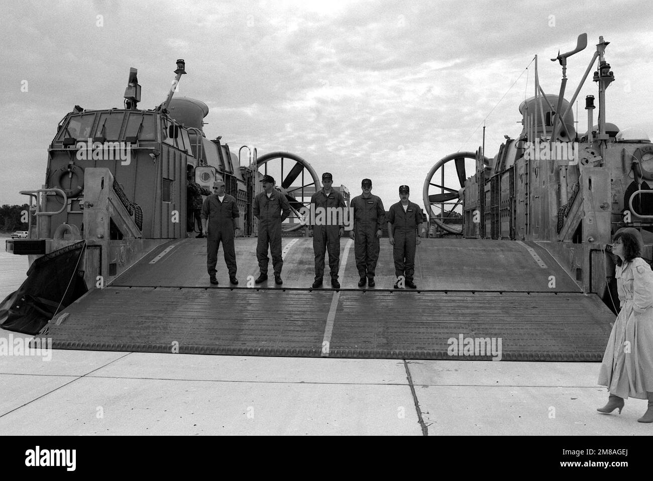 The crew of an air cushion landing craft (LCAC) from Assault Craft Unit ...
