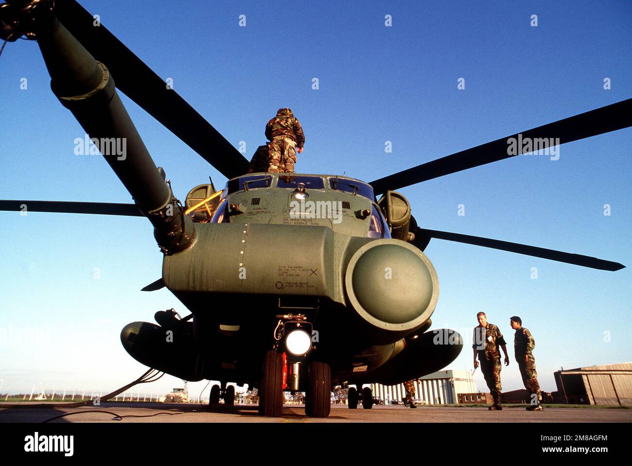 Members of the 21st Special Operations Squadron prepare an MH-53J ...
