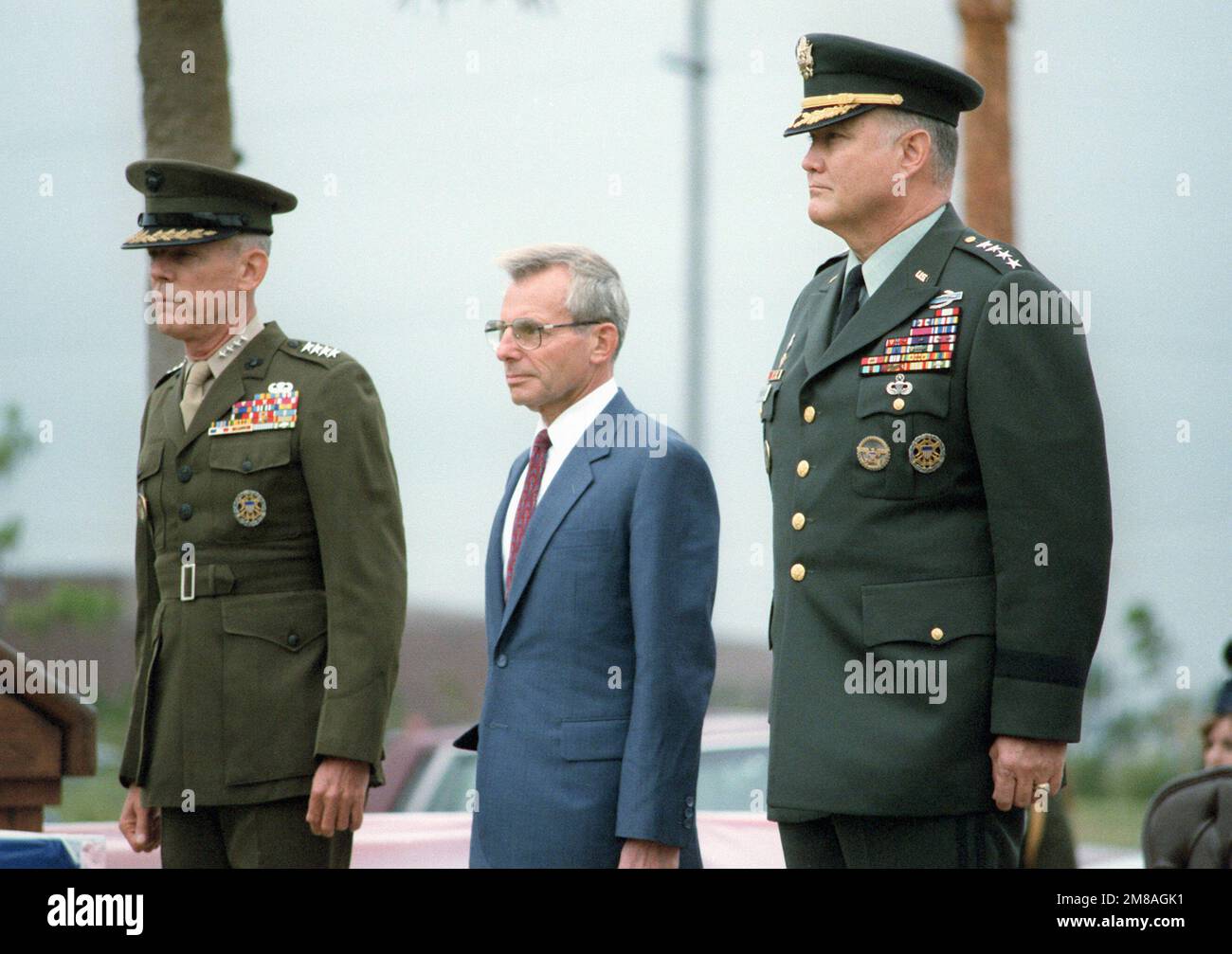 Secretary of Defense Frank C. Carlucci transfers the rein of command of ...