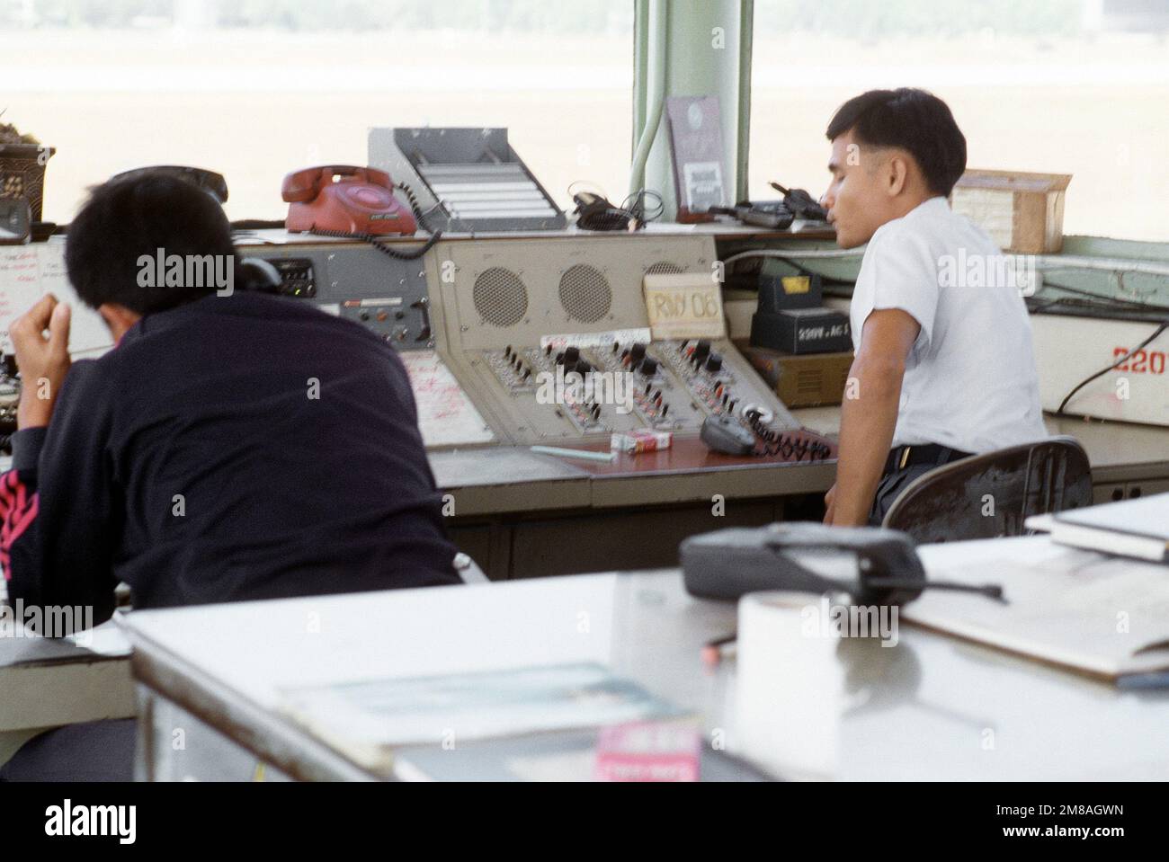 Technicians monitor equipment in the control tower at Korat Royal Thai ...