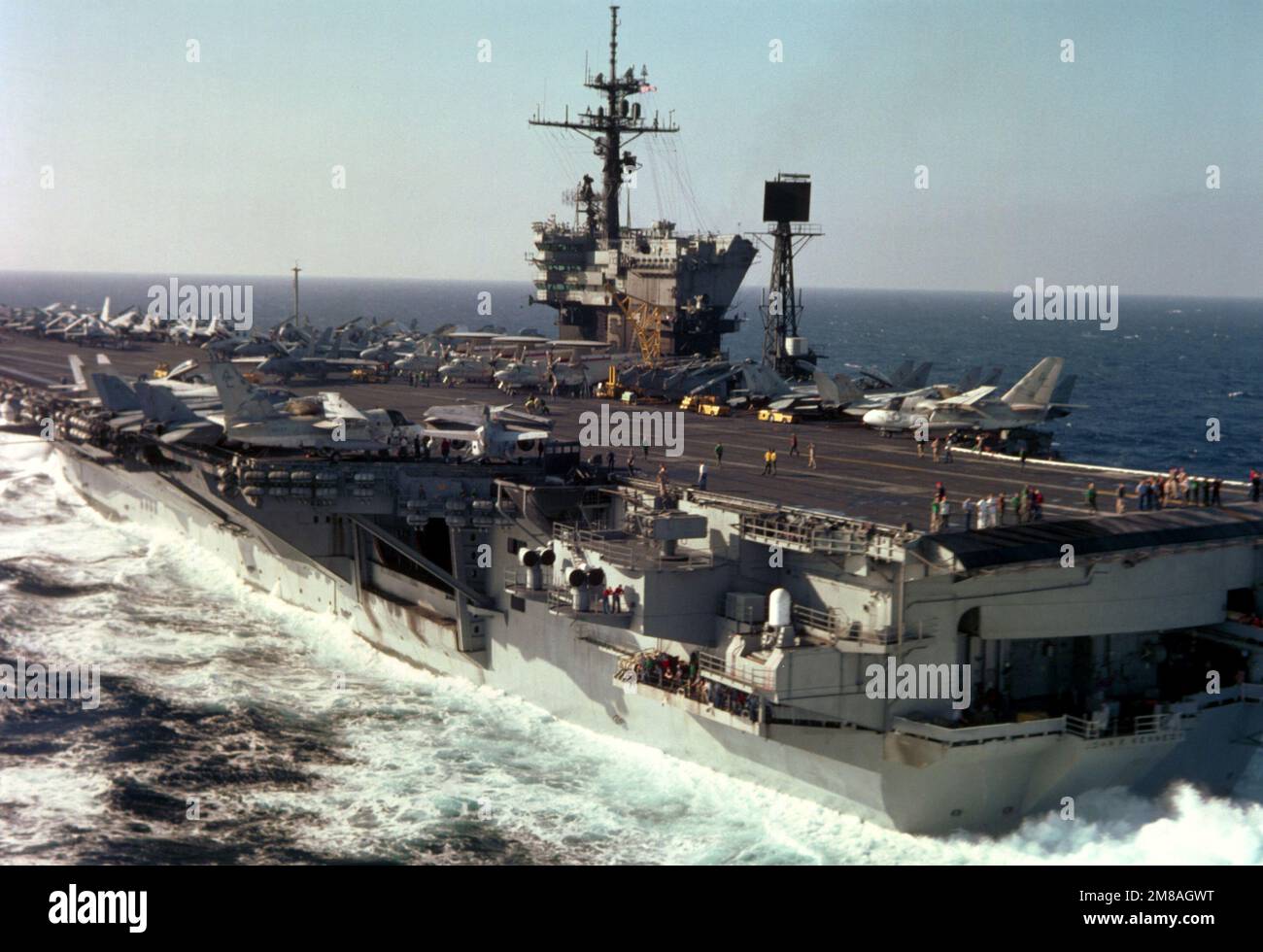 A port quarter view of the aircraft carrier USS JOHN F. KENNEDY (CV-67 ...