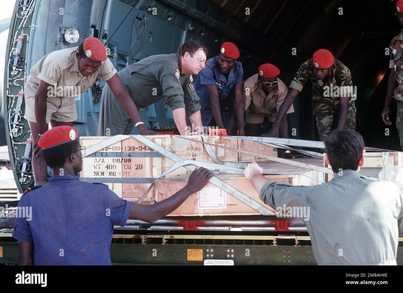 Members of Niger's armed forces help unload a C-5 Galaxy aircraft's ...
