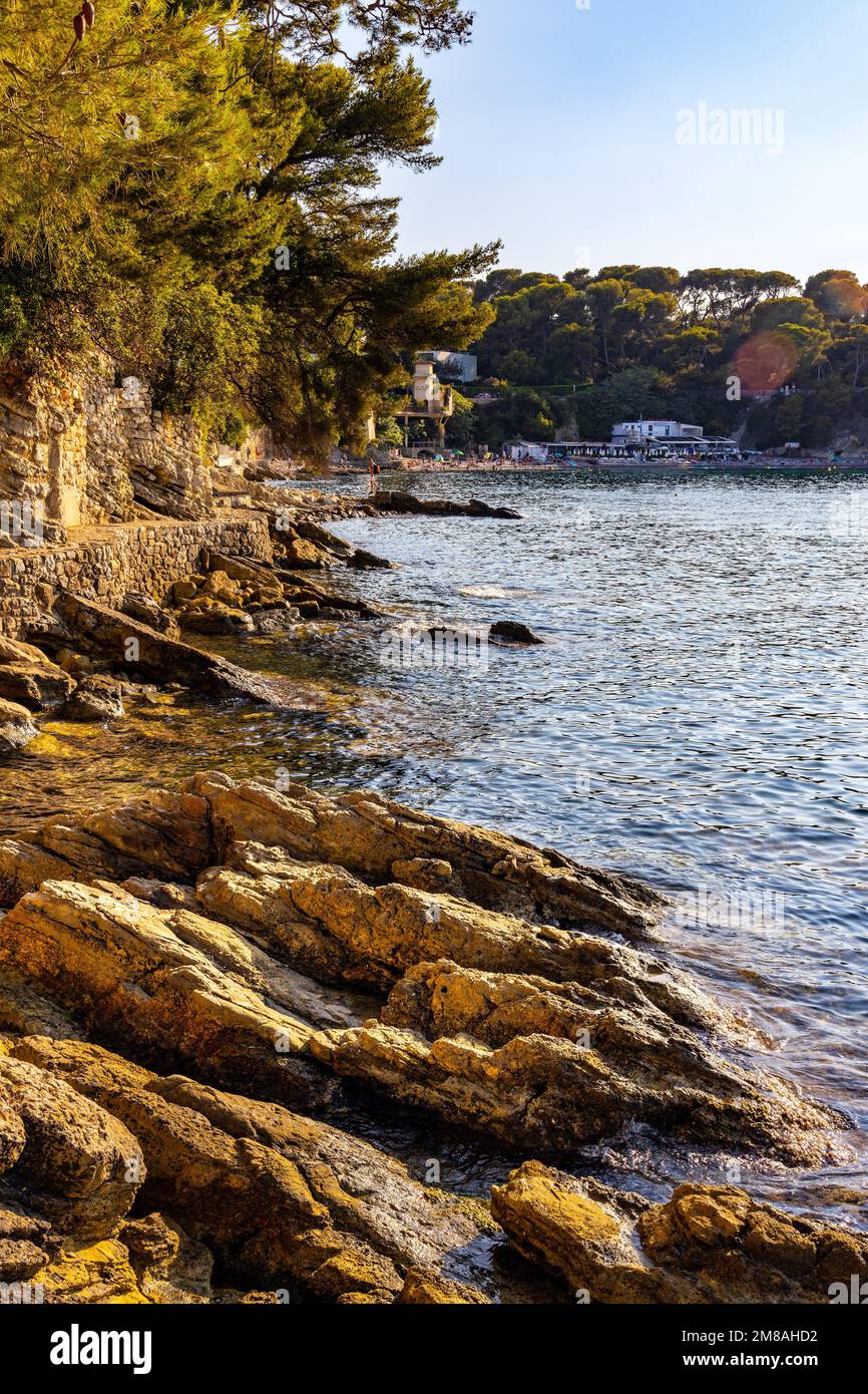 Rocky shoreline landscape of Saint-Jean-Cap-Ferrat town with ...
