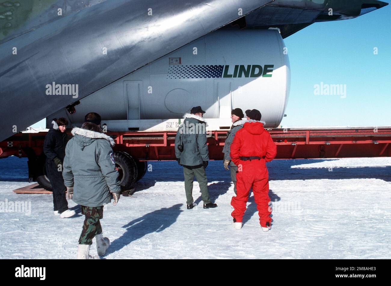 A 20,150-pound tank of liquid helium is unloaded from a 7th Military ...