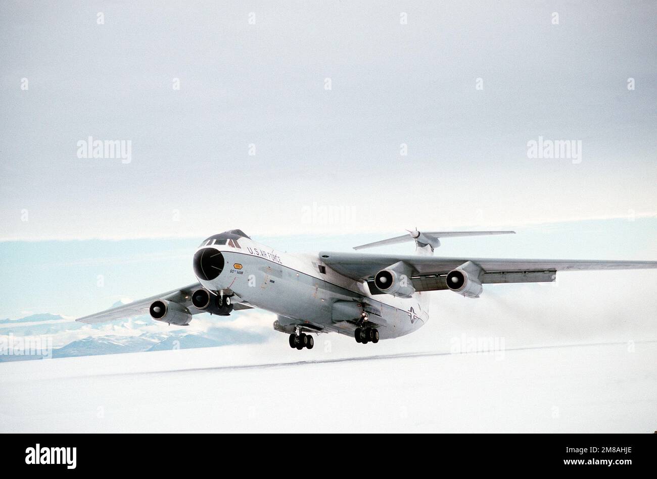 A 60th Military Airlift Wing C-141B Starlifter aircraft departs the ...