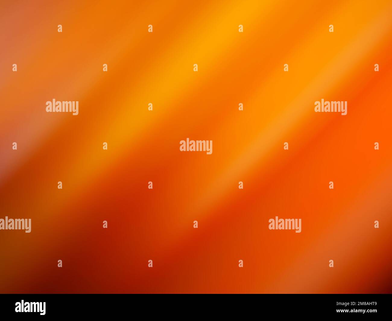 Abstract bright orange defocused background Stock Photo - Alamy
