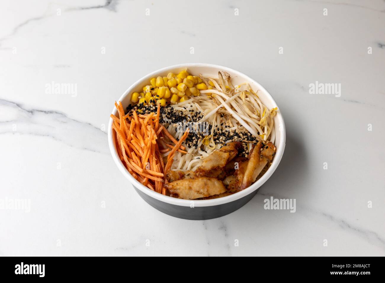 A tasty poke bowl with corn on the marble table Stock Photo - Alamy