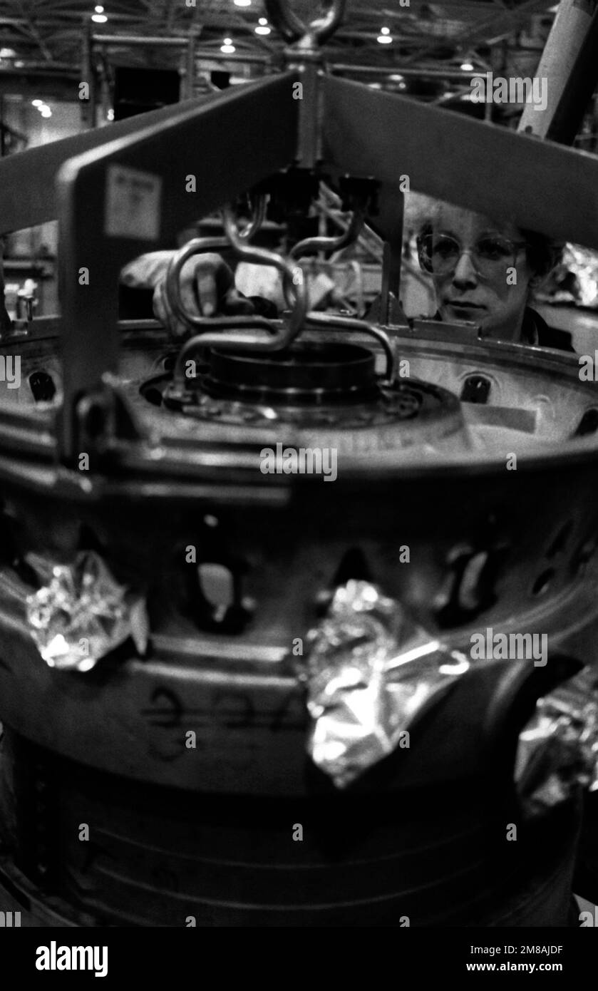 Aviation Machinist's Mate 3rd Class Rose Schmitz works to assemble an ...