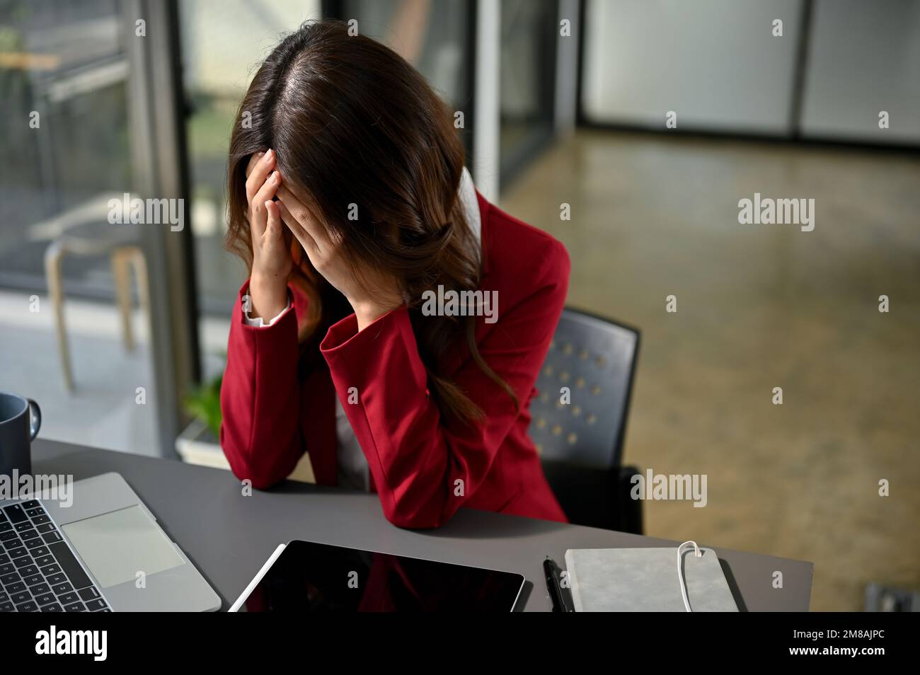 Stressed and depressed millennial Asian businesswoman crying at her ...