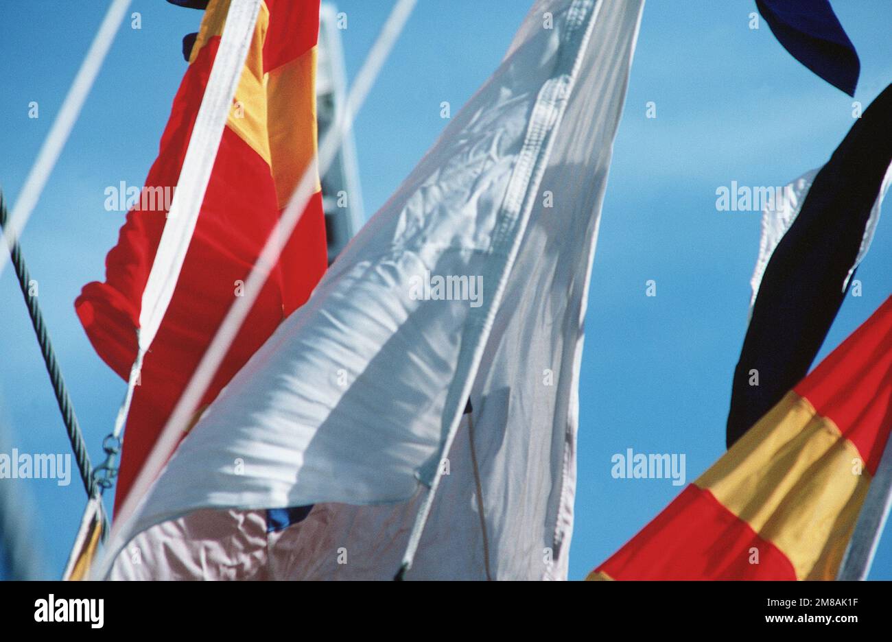 Signal flags fly aboard the destroyer tender USS PUGET SOUND (AD 38 ...