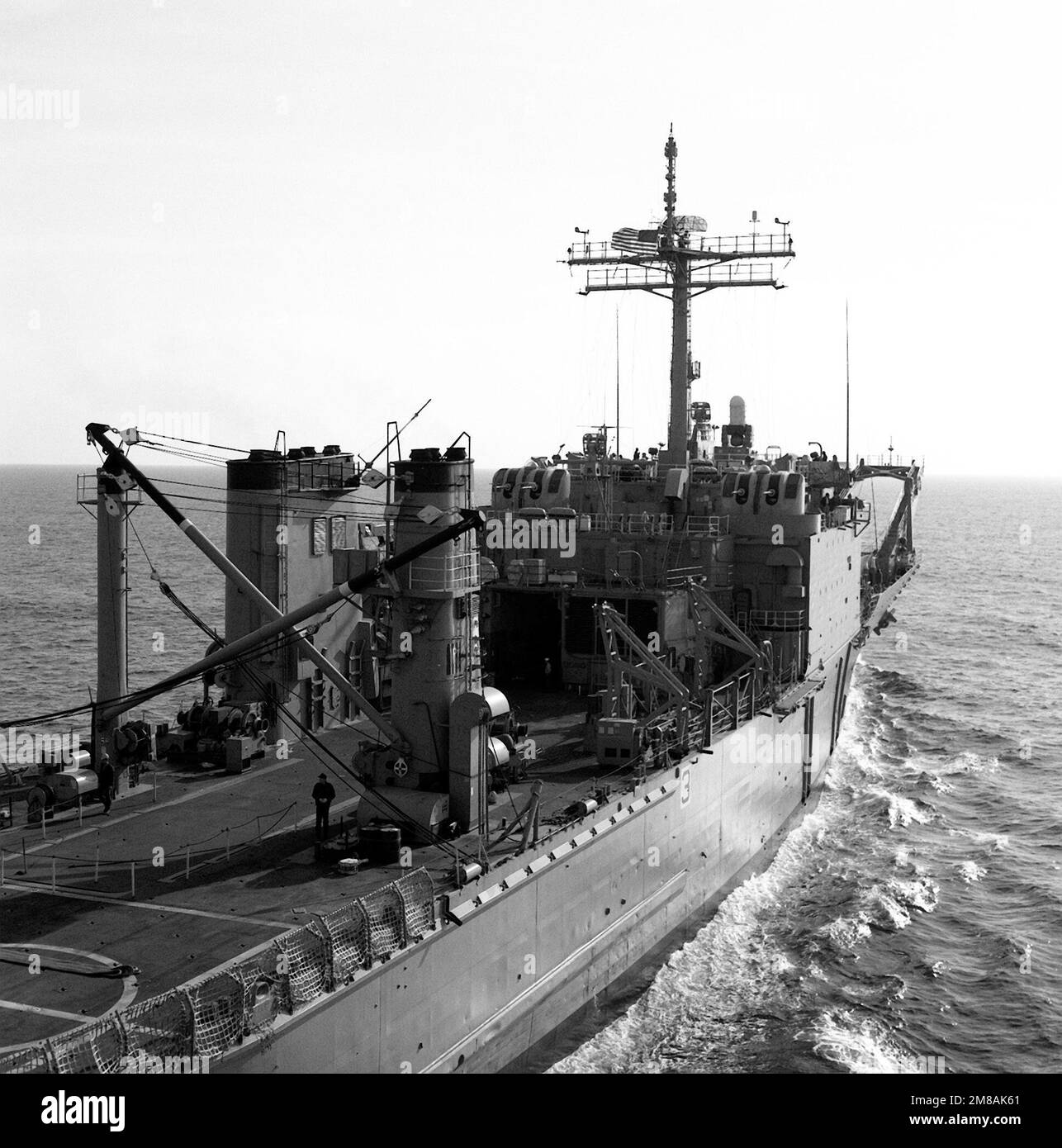A partial starboard quarter view of the tank landing ship USS MANITOWOC ...