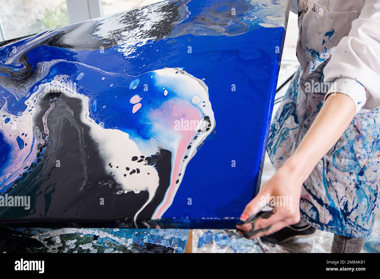 Cropped photo of hands of woman wearing white shirt, robe covered with ...