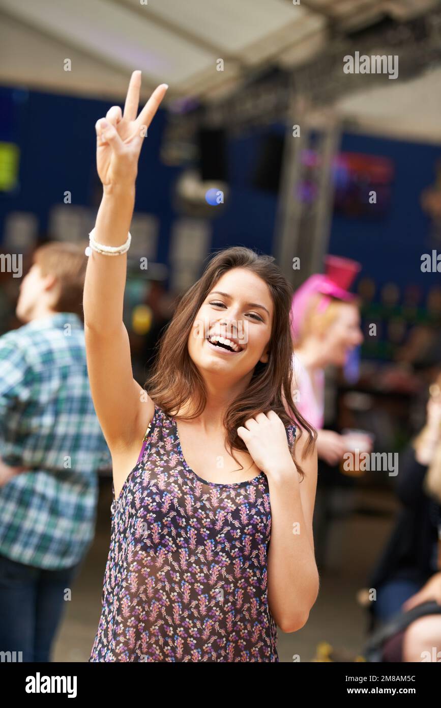 Shes As An Easy Going Soul A Carefree Young Woman Giving A Peace Sign