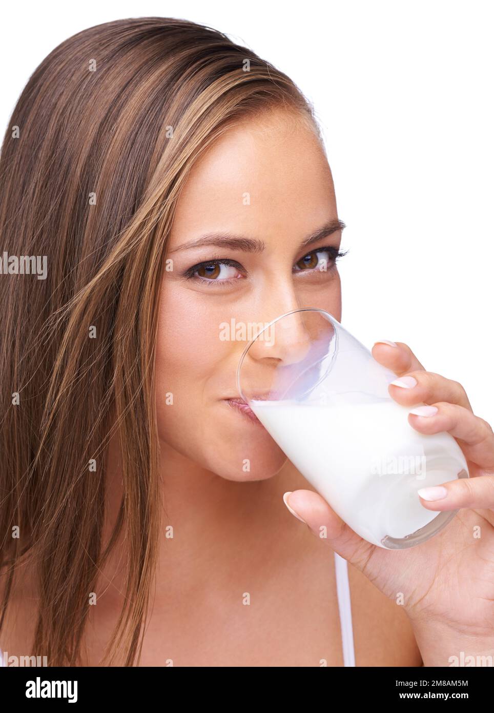 Portrait, milk drink and happy woman in studio, isolated white ...