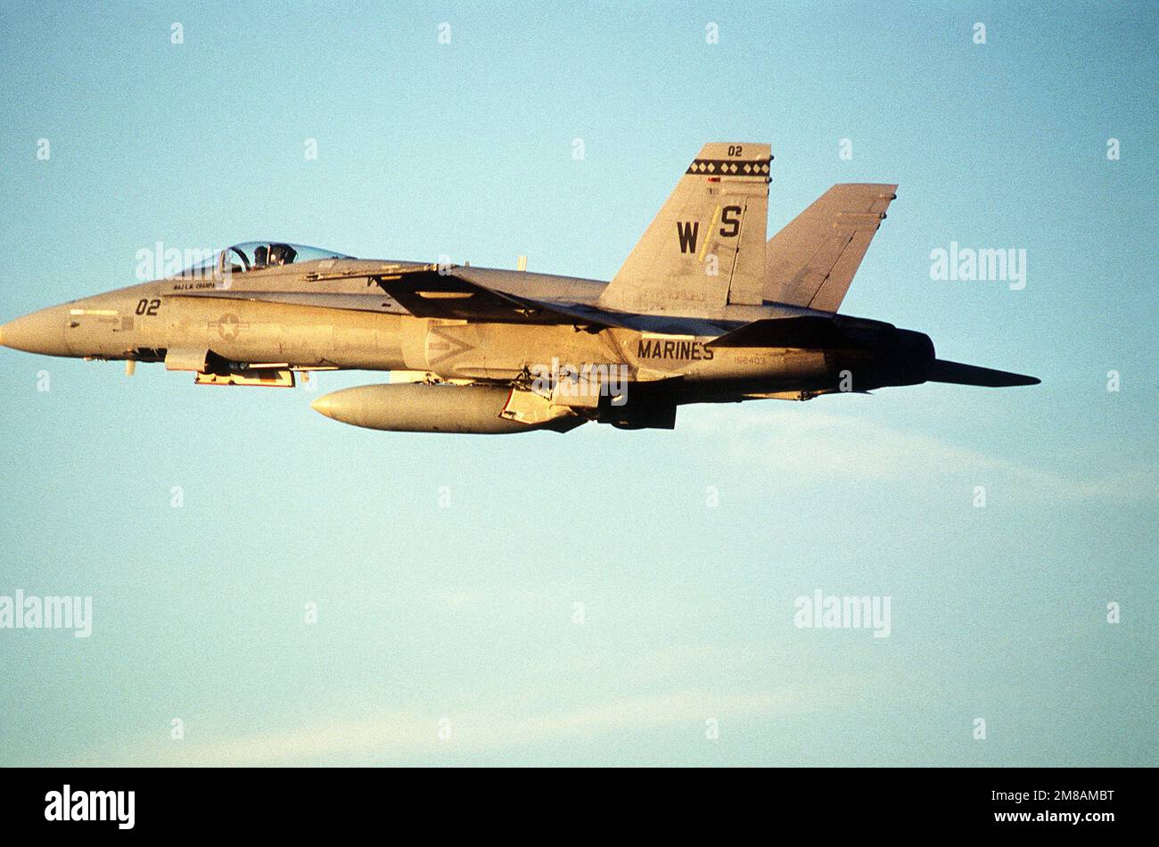 An air-to-air left side view of a Marine Fighter-Attack Squadron 323 ...
